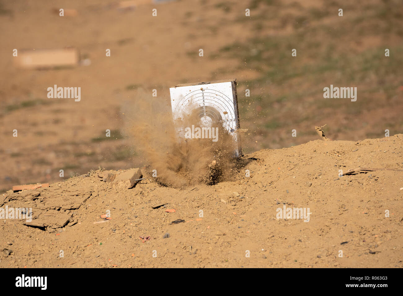 Target practice aim at the outdoor range. Bullet hits the ground ...