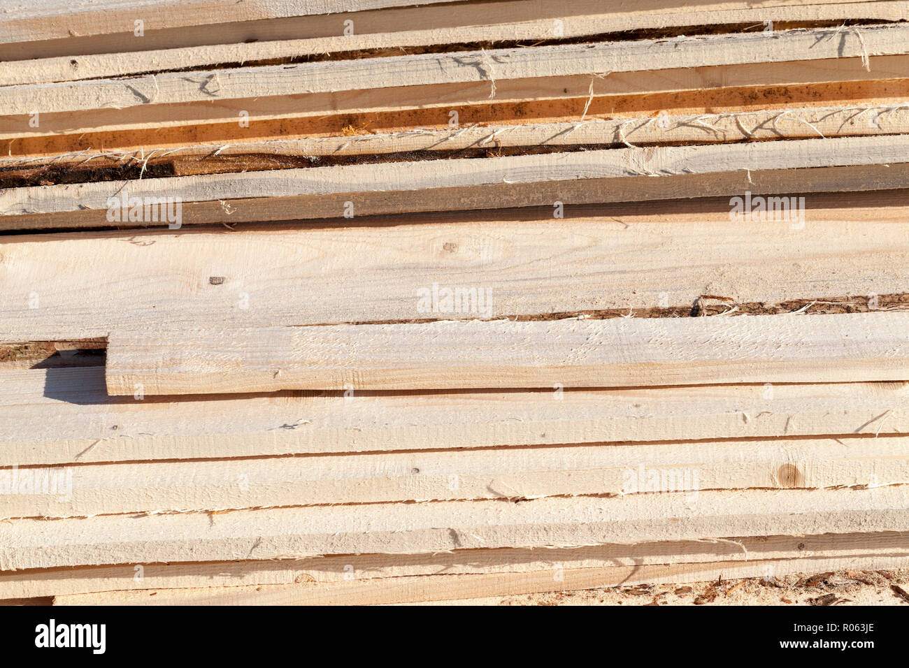 sawn rough board from a pine trunk, building material for a house ...