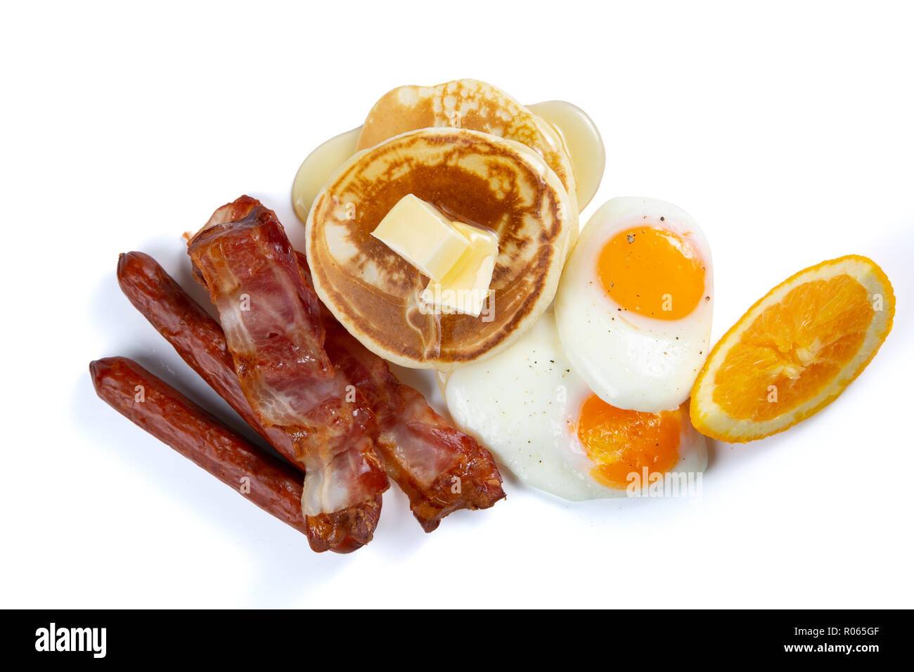 Creative layout - breakfast essentials - eggs, pancakes, bacon, on ...