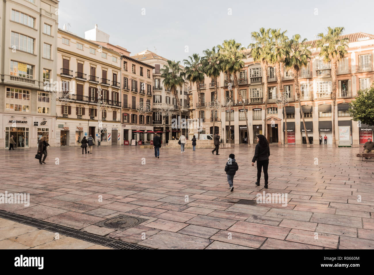 visiting the beautiful city of Malaga among churches historic buildings ...