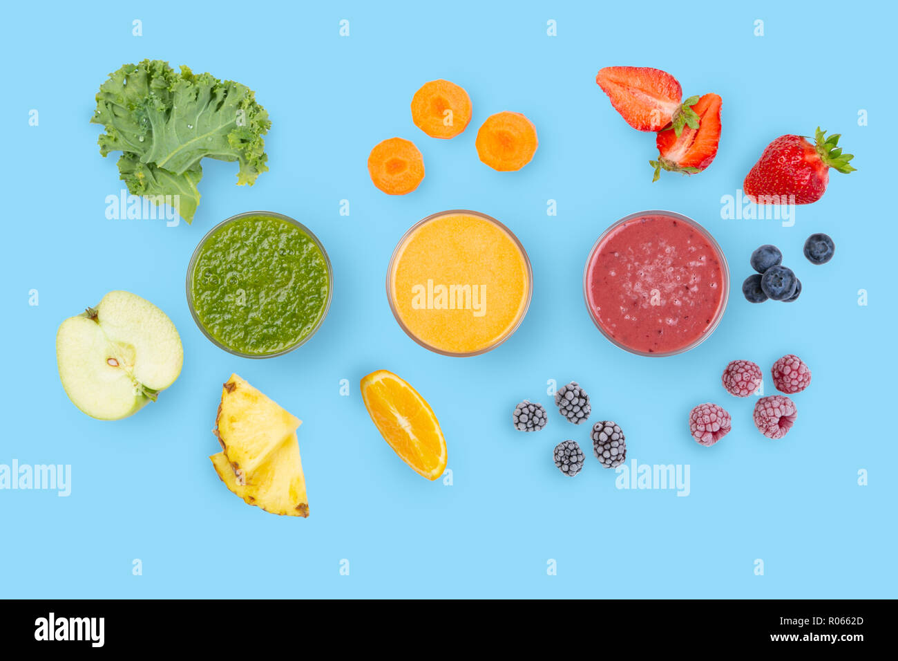 Creative layout of fresh smoothies with ingredients on pastel ...