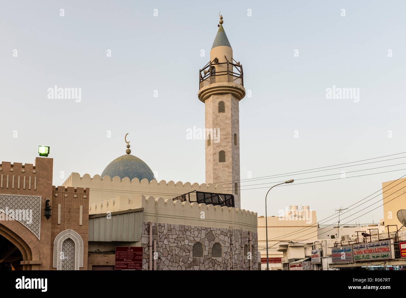 The minaret of a mosque at the Muttrah souk in Muscat, Oman Stock Photo ...