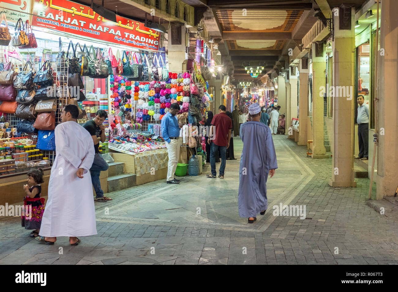 Shoppers at the souk at Muttrah Corniche, Muscat, Oman. This historic ...