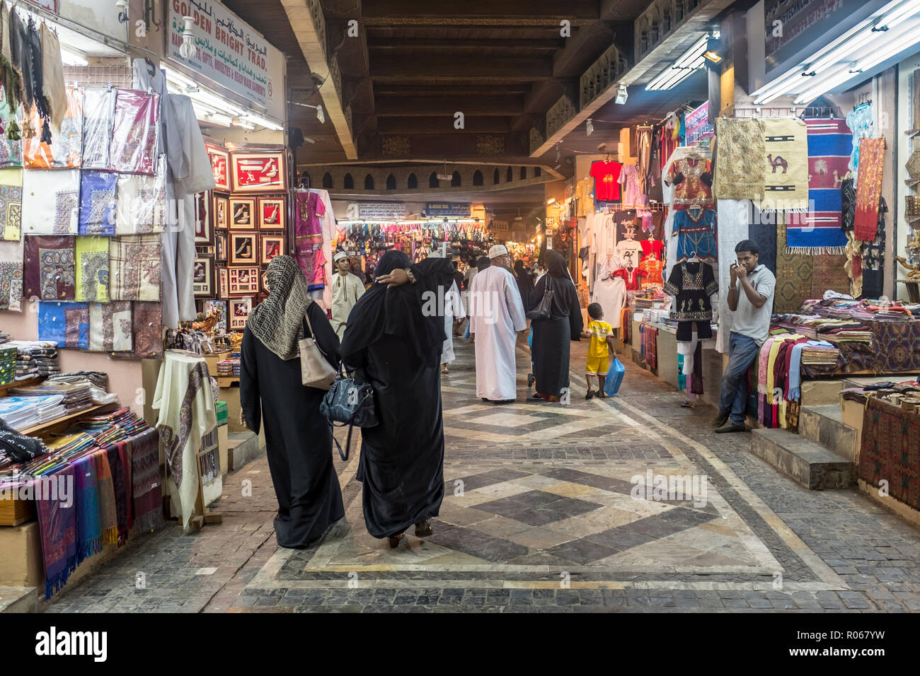 Shoppers at the souk at Muttrah Corniche, Muscat, Oman. This historic ...