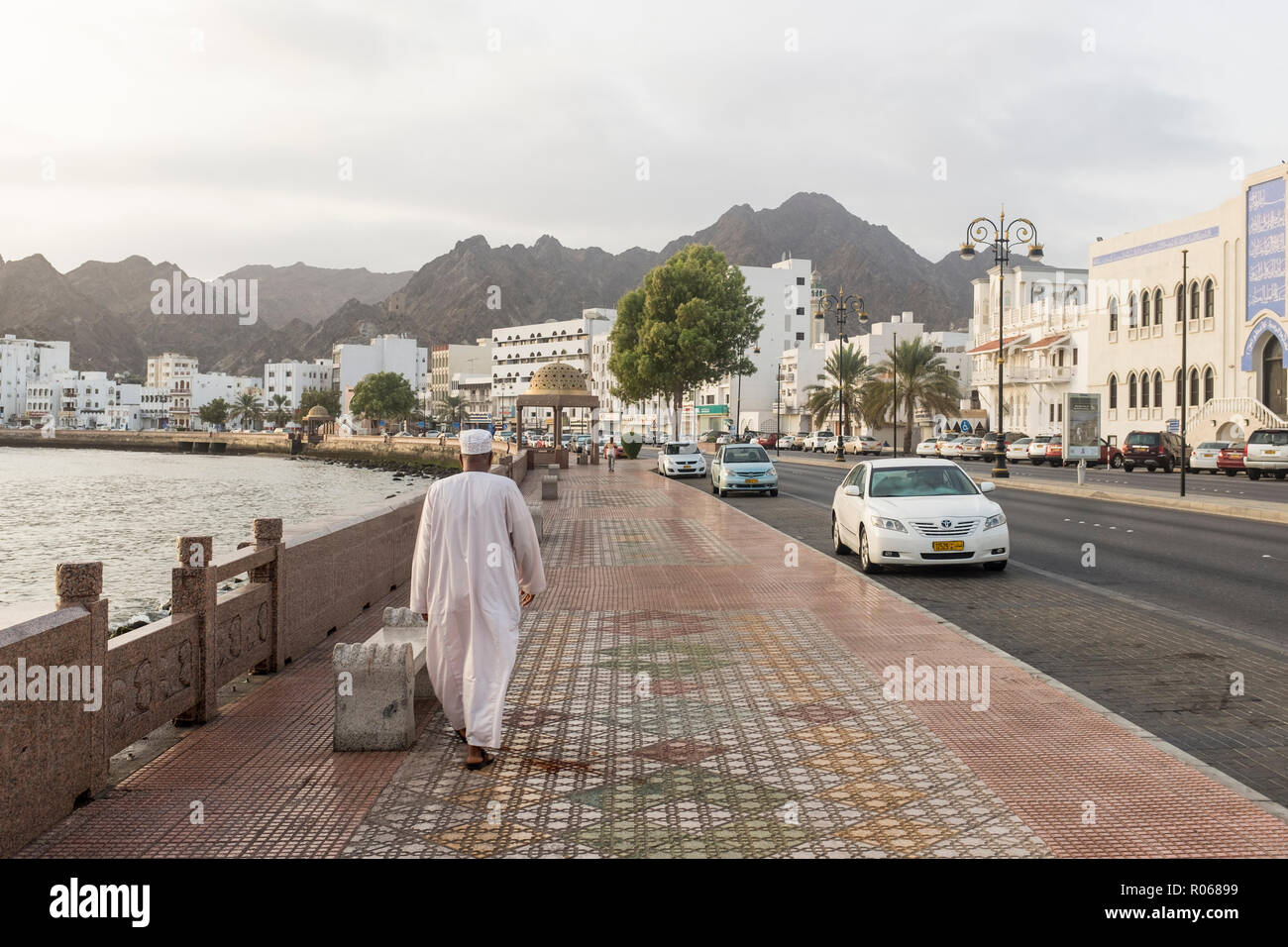 A man wearing national dress - a white dishdasha and embroidered kuma ...