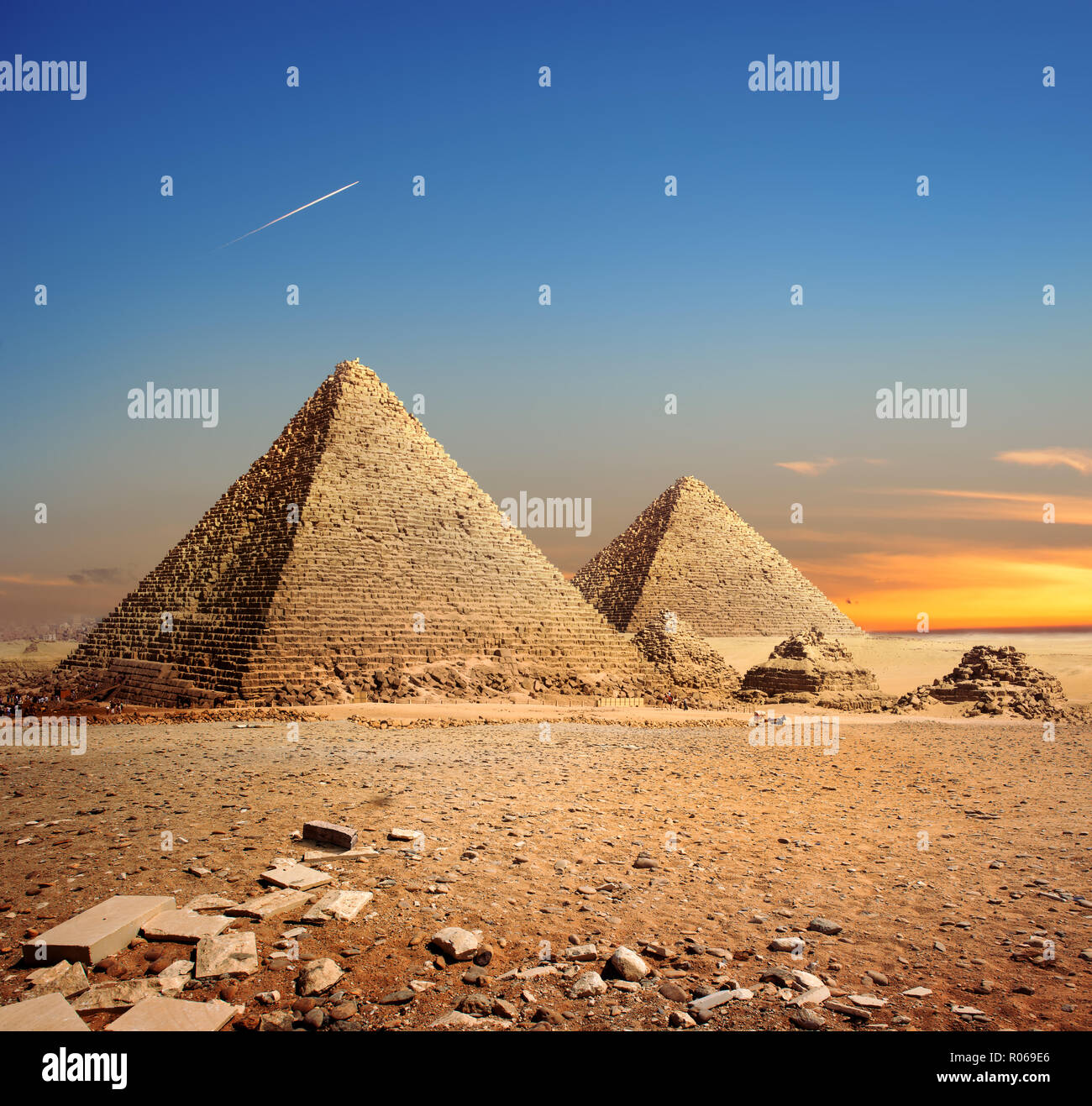 Egyptian pyramids in the desert at sunset Stock Photo - Alamy