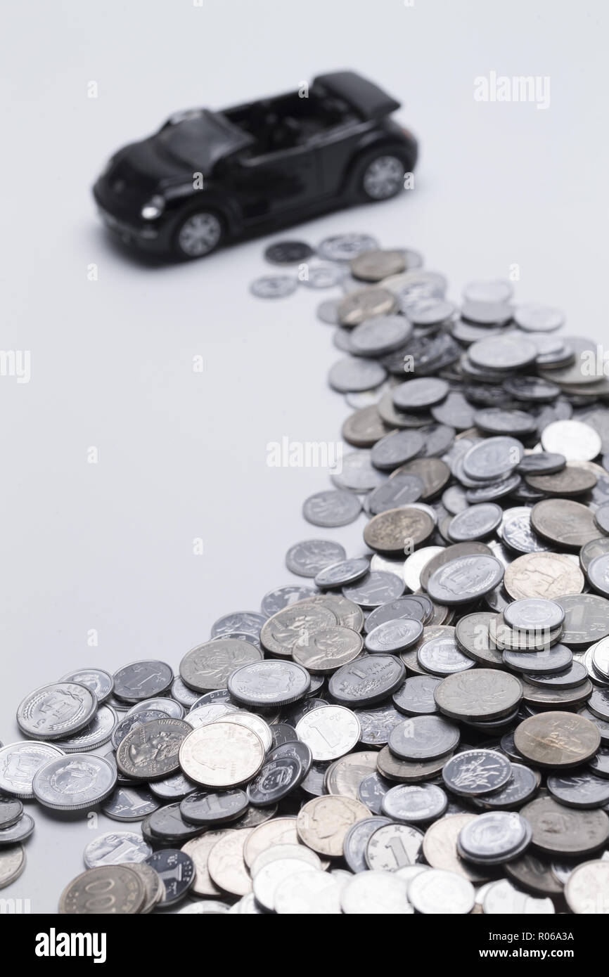 COINS and car model Stock Photo - Alamy