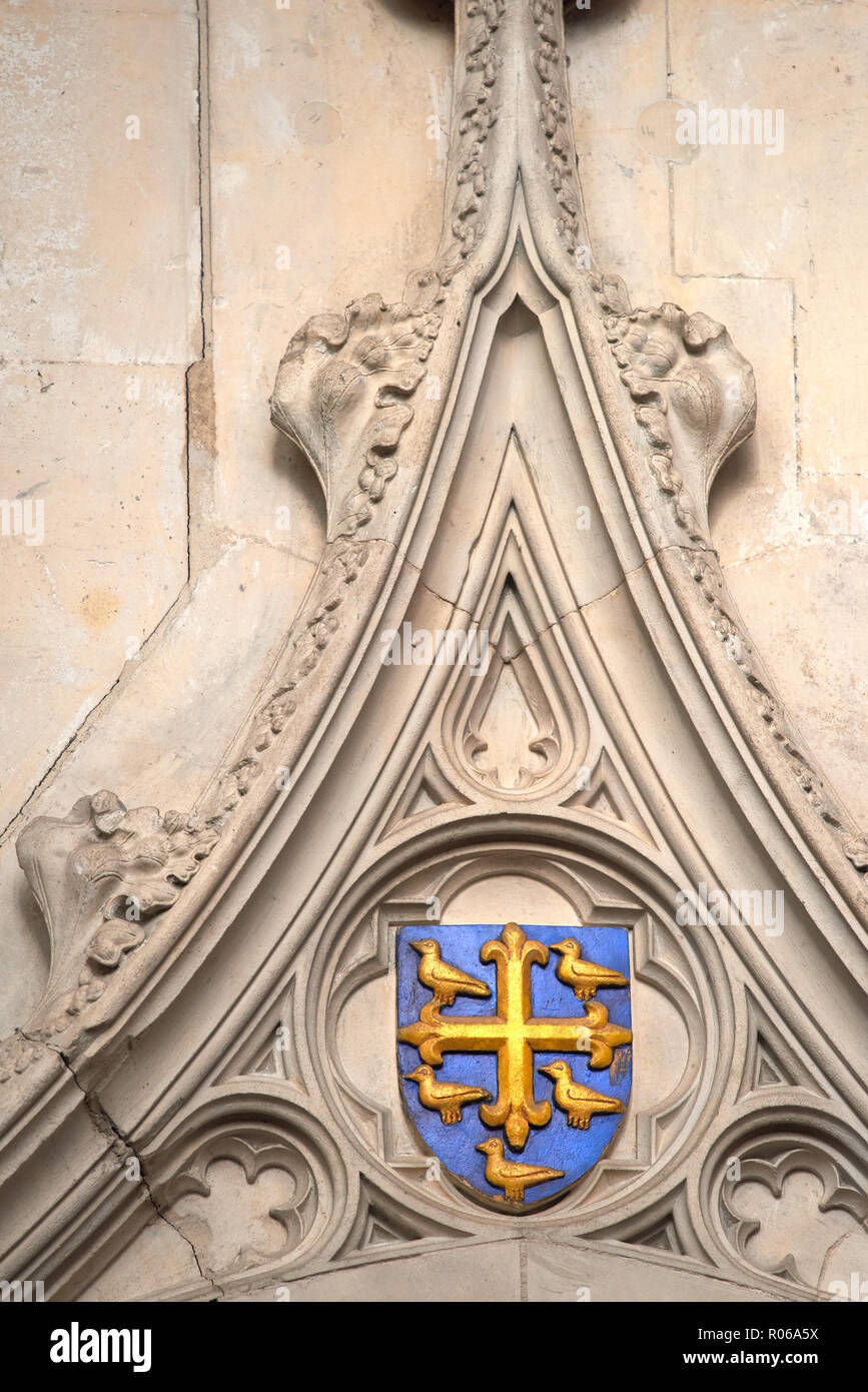 Painted stone badge on a wall in the choir of the tudor medieval chapel ...