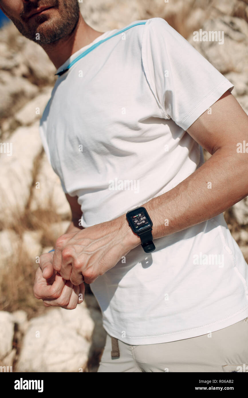 Man rock climbing with watch hi-res stock photography and images - Alamy