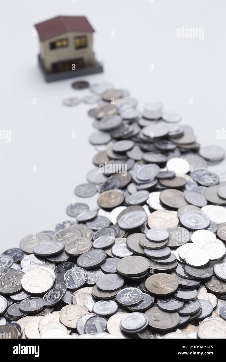 COINS and building model Stock Photo - Alamy