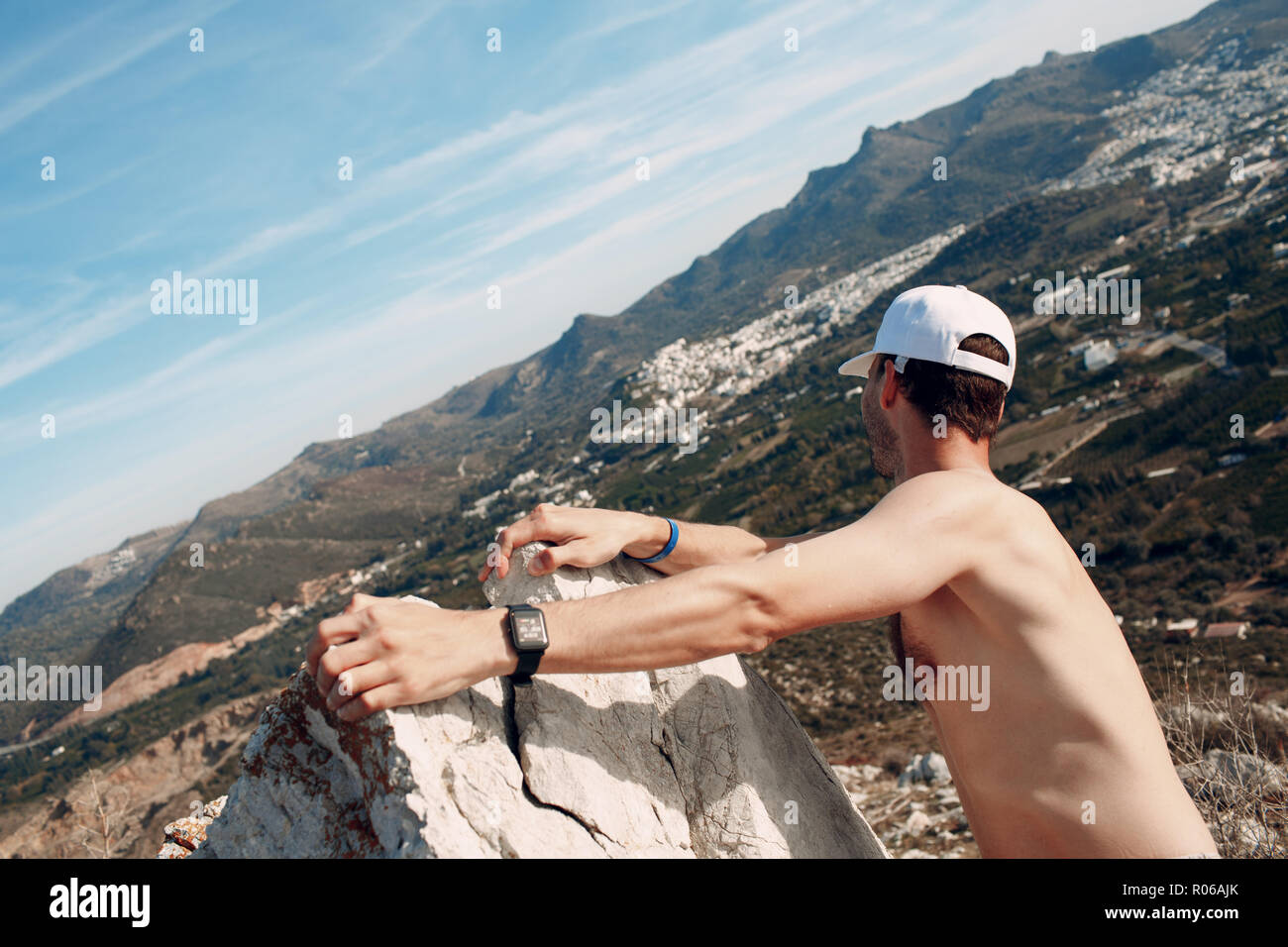 Man rock climbing with watch hi-res stock photography and images - Alamy