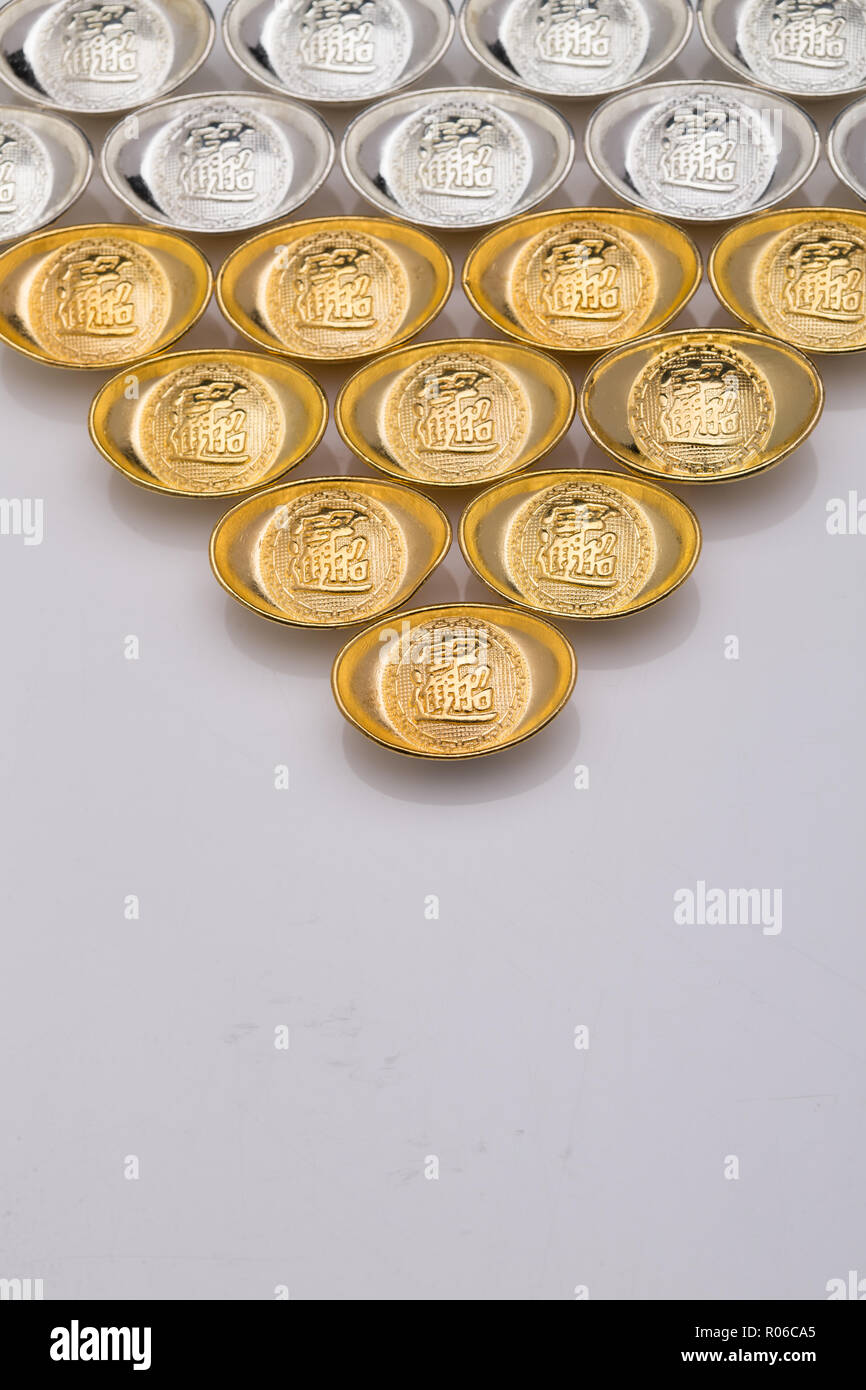 Gold ingot and silver treasure Stock Photo - Alamy