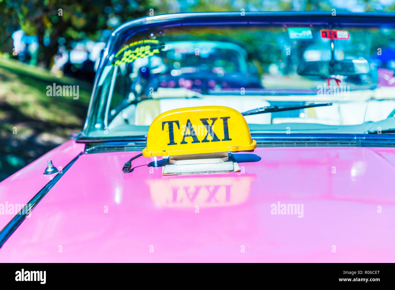 A taxi sign on a classic American car used as a taxi in Varadero, Cuba ...