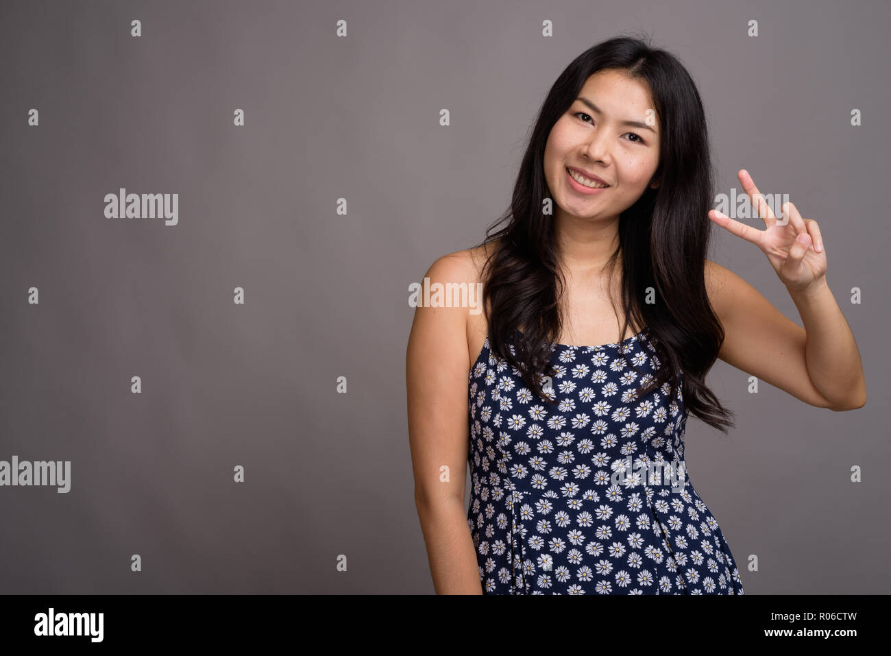 Asian Tourists Peace Sign
