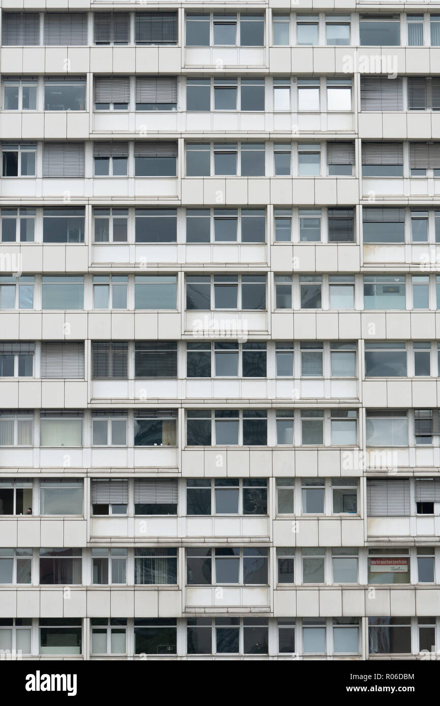White and grey uniform facade of old apartment block, Berlin, Germany ...