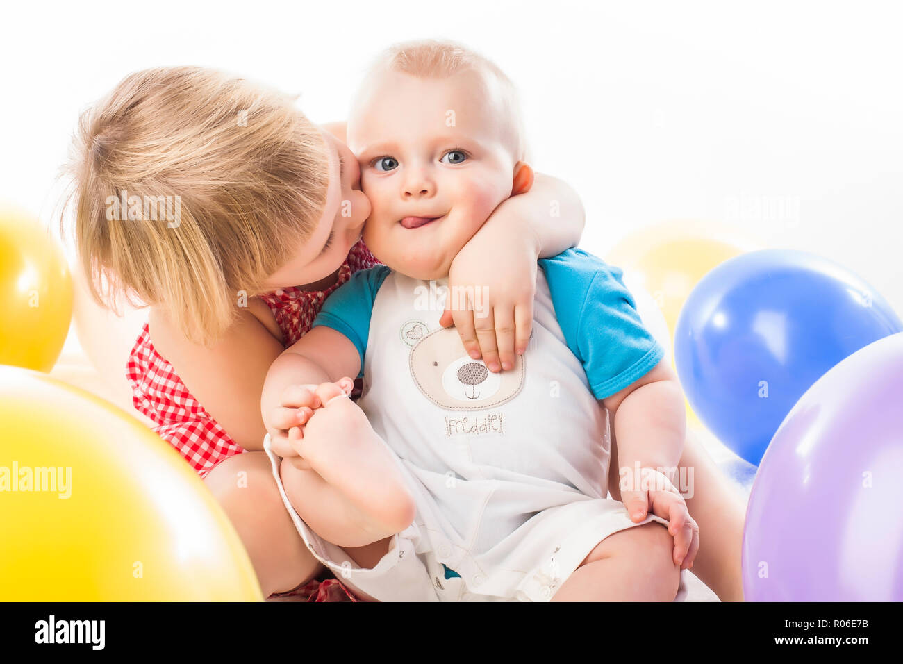Siblings posing in studio Stock Photo - Alamy