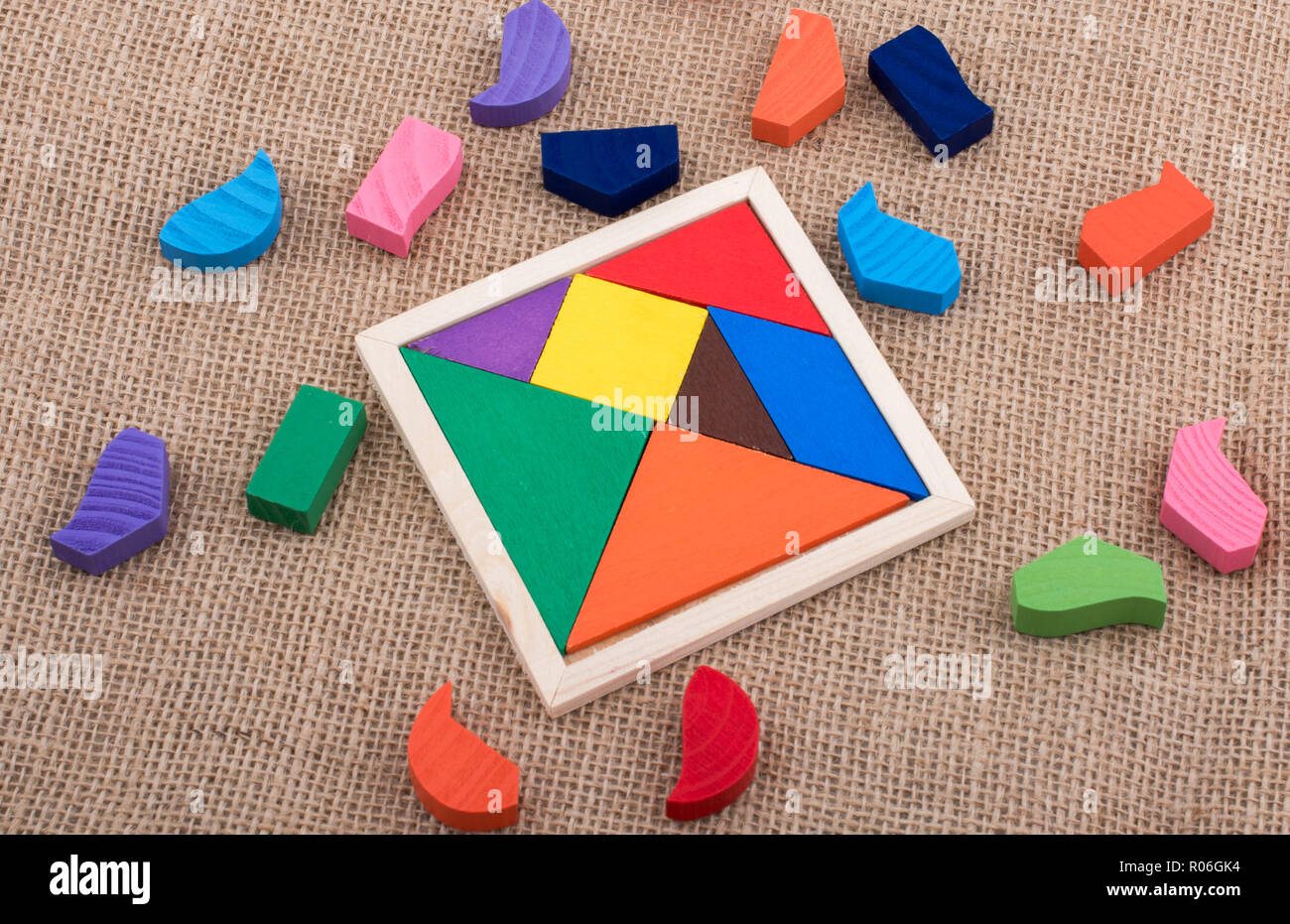 Colorful pieces of a square tangram puzzle Stock Photo - Alamy