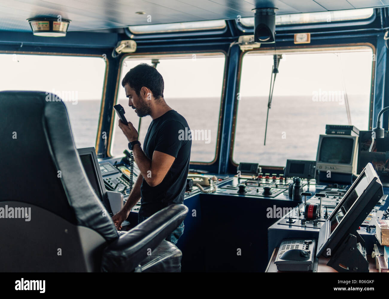 Marine navigational officer is reporting by VHF radio Stock Photo - Alamy