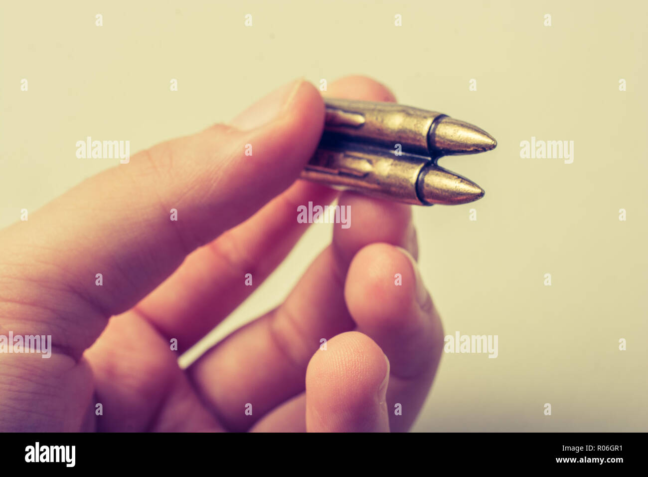 Bullet in the hand as Conceptual photography against the war Stock ...
