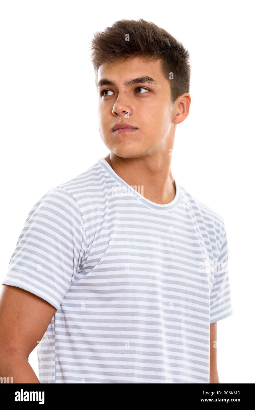 Studio shot of thoughtful young handsome man looking back Stock Photo ...
