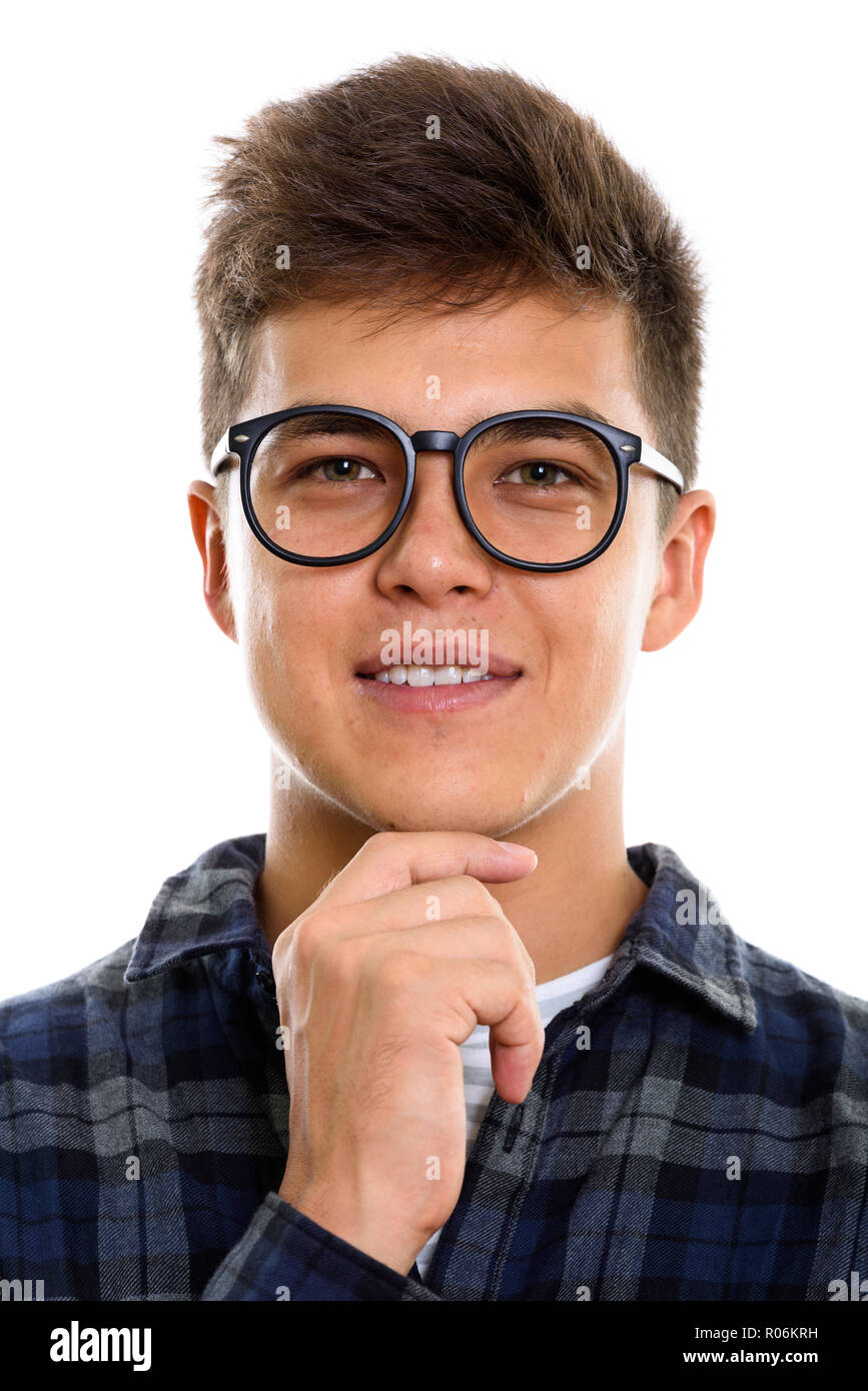 Face of young happy man smiling while thinking Stock Photo - Alamy