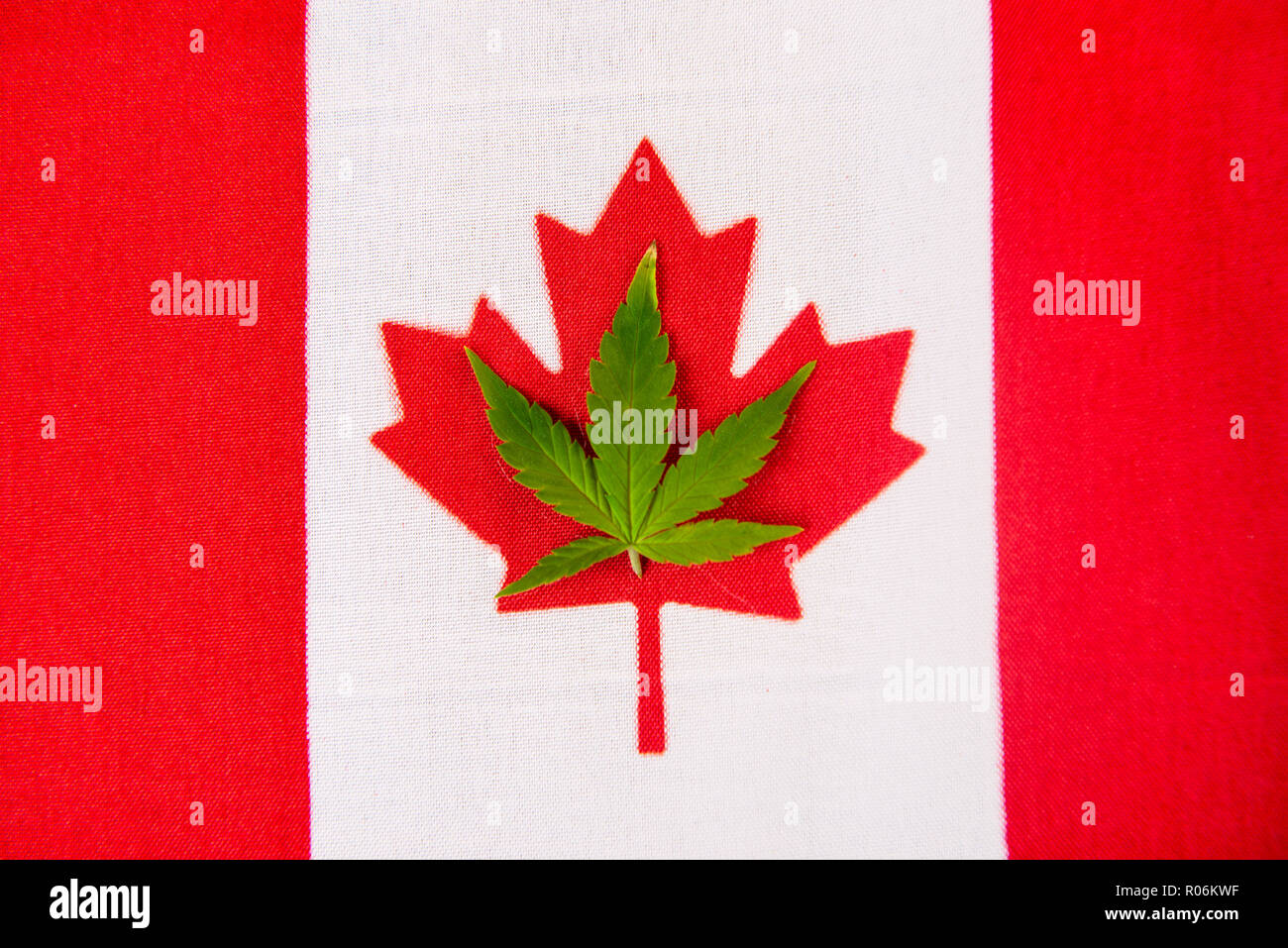 Canadian flag with cannabis leaf - canada marijuana concept background ...
