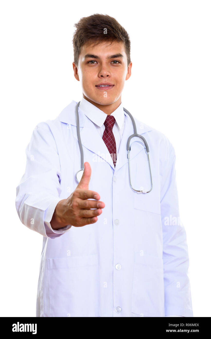 Studio shot of young handsome man doctor giving handshake Stock Photo ...