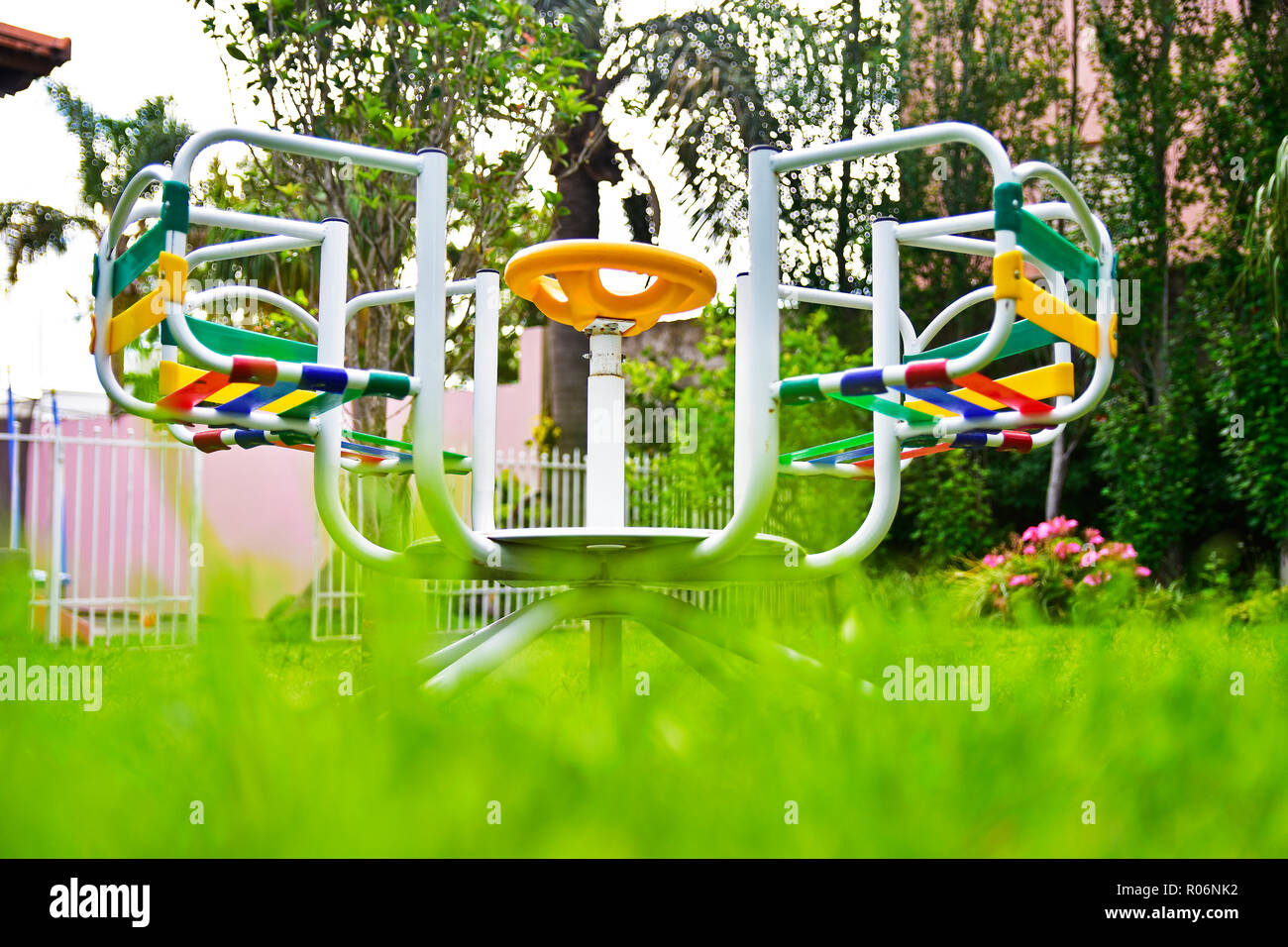 Children merry go round playground hi-res stock photography and images ...