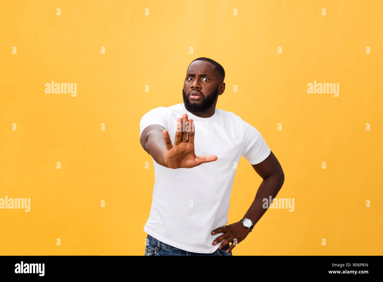 Portrait shock and annoyed displeased young man raising hands up to say ...