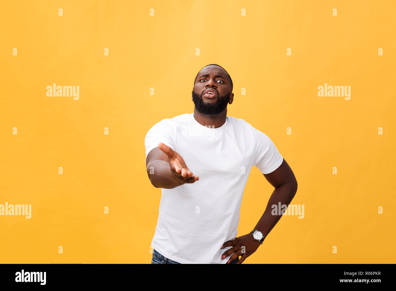 Portrait shock and annoyed displeased young man raising hands up to say ...
