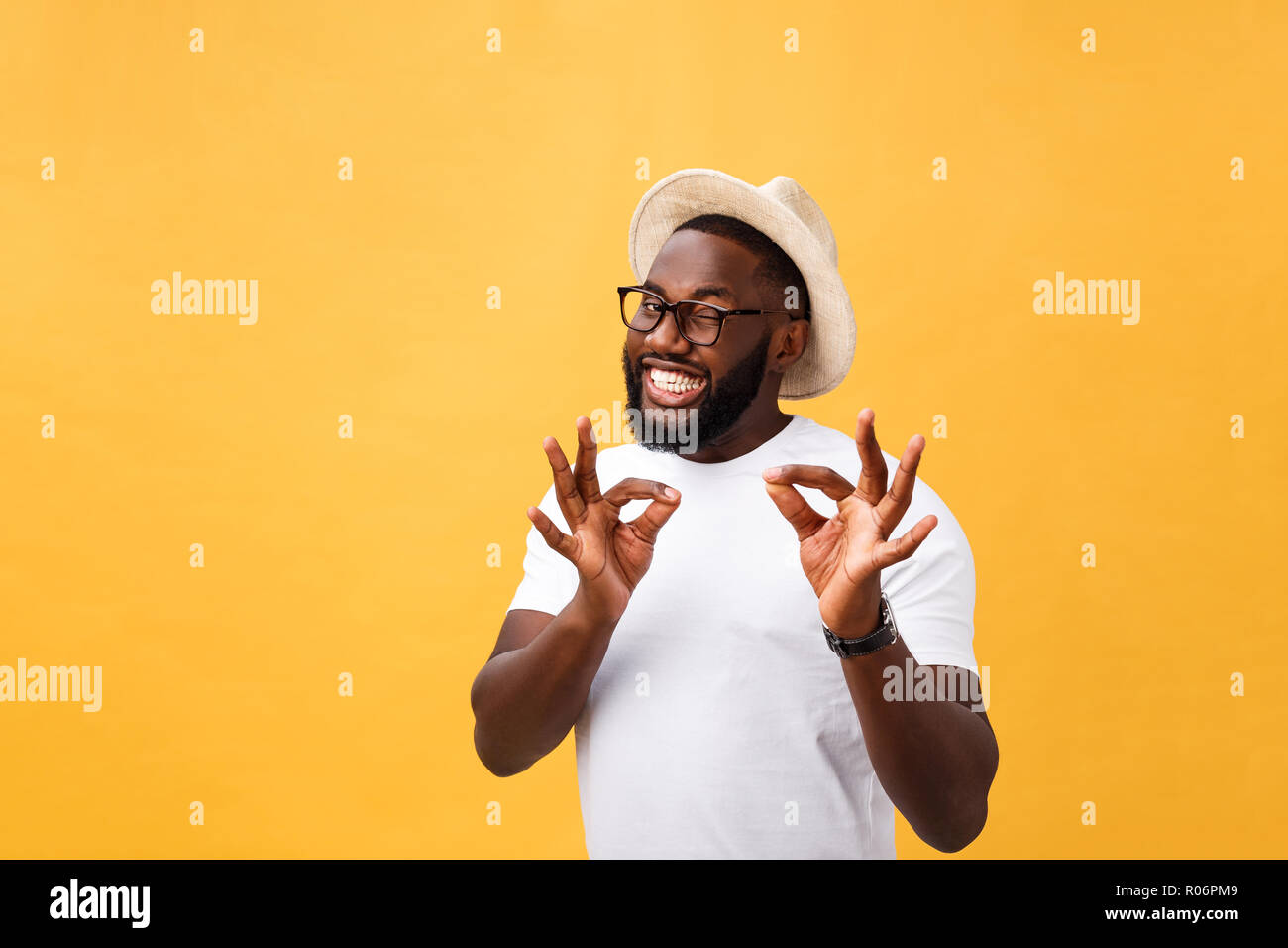Single handsome muscular Black man with shaved head, folded arms and ...