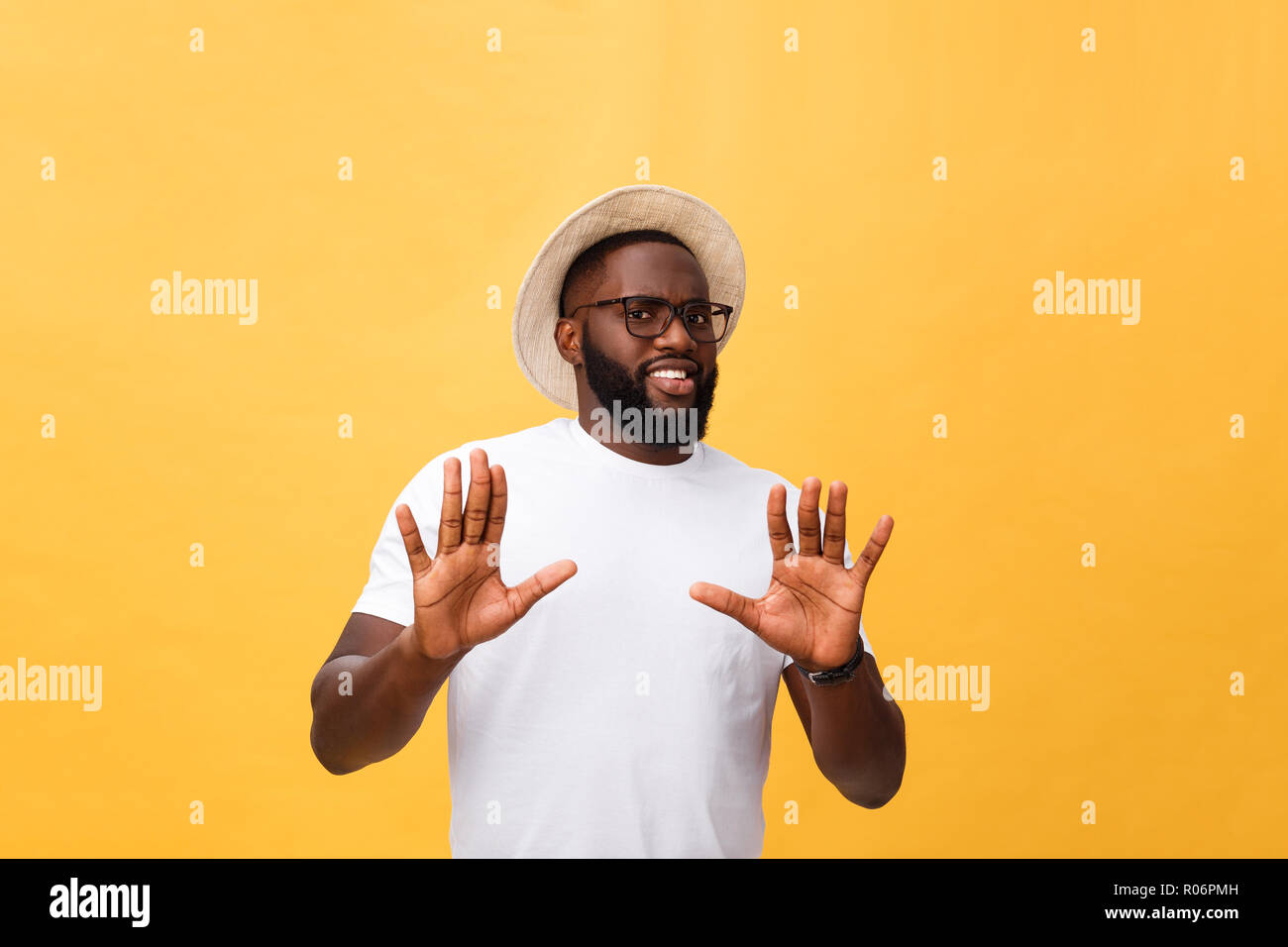 Portrait shock and annoyed displeased young man raising hands up to say ...