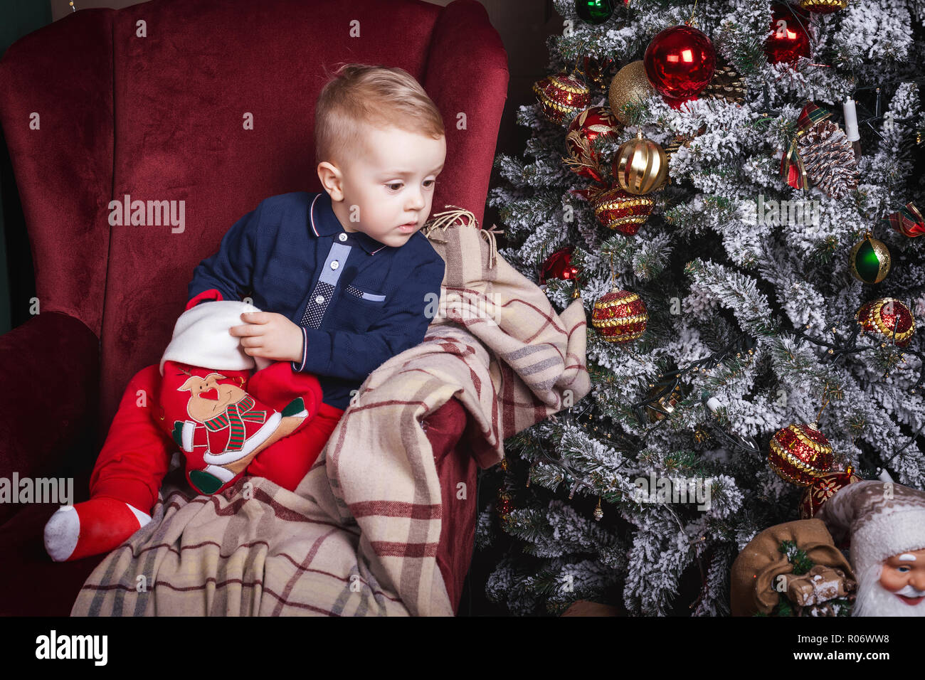 interested little boy holding a christmas stocking Stock Photo - Alamy
