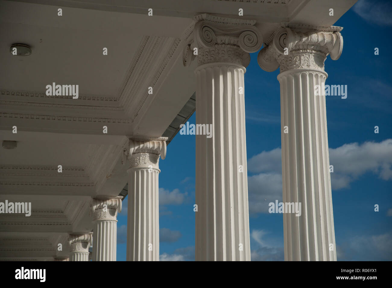 Columns on blue sky background Stock Photo - Alamy
