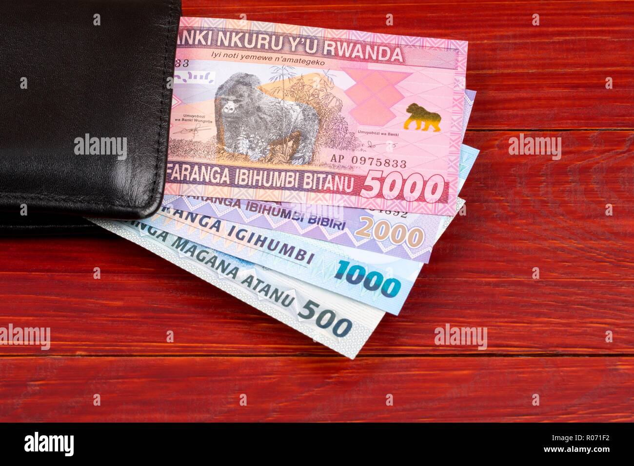 Rwandan money in the black wallet Stock Photo - Alamy