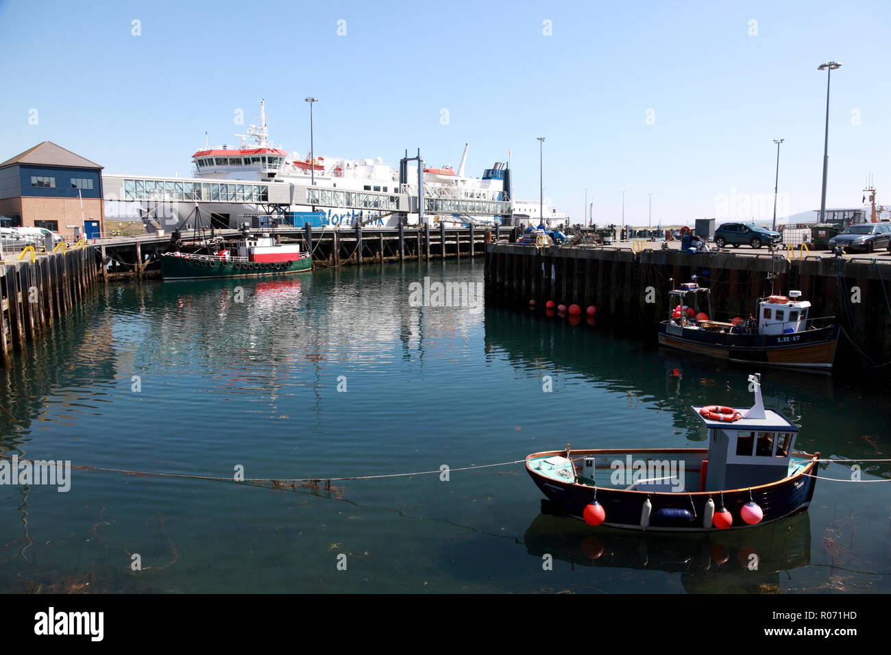 The harbour in Stromness, Orkney with fishing boats and the NorthLink ...