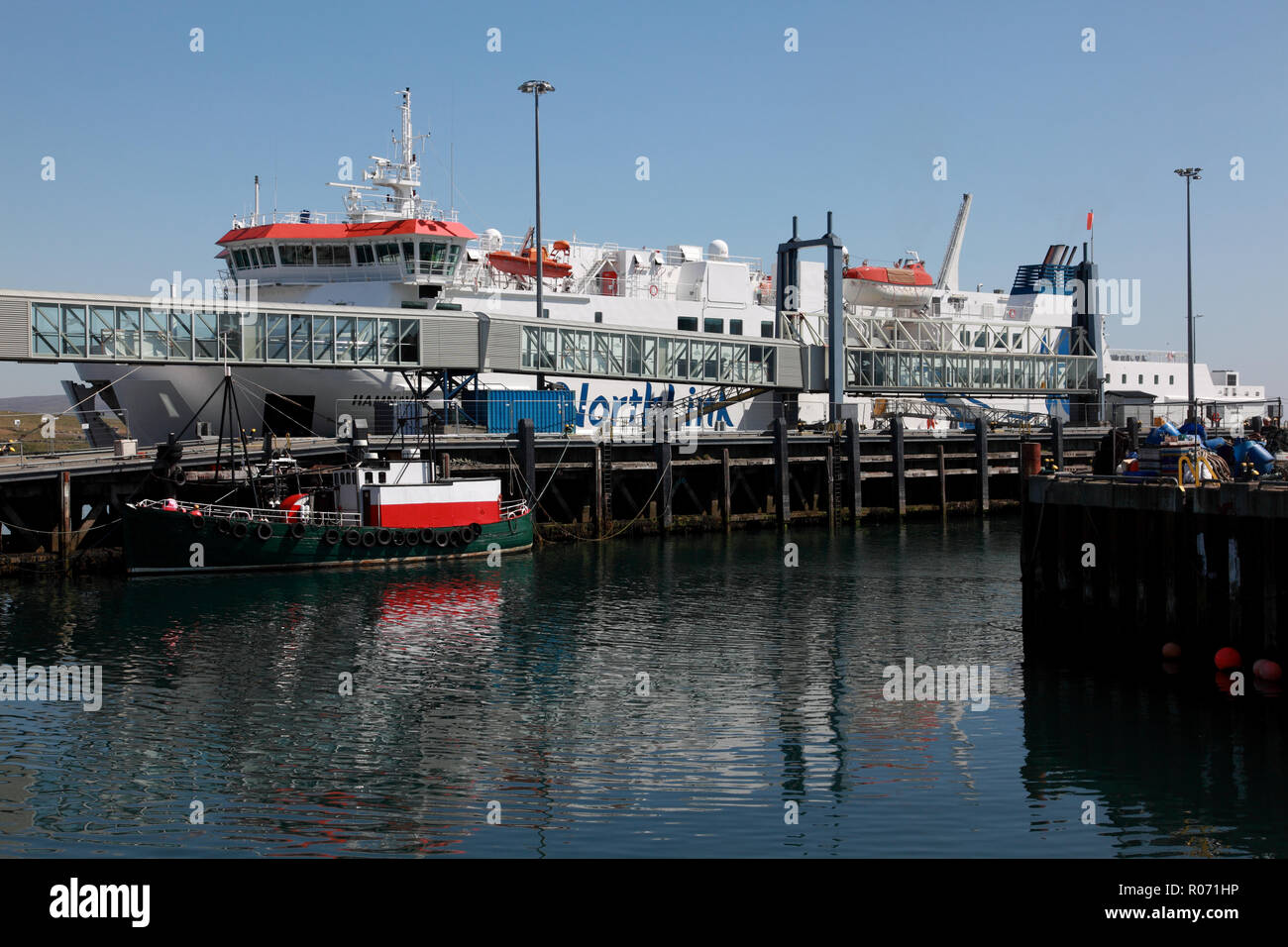 The harbour in Stromness, Orkney with fishing boats and the NorthLink ...