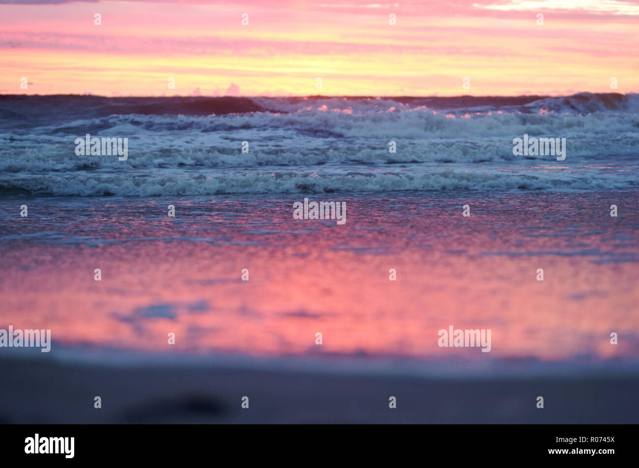 Sunset over the sea. Reflection of sunlight in the sea waves. Red sky ...