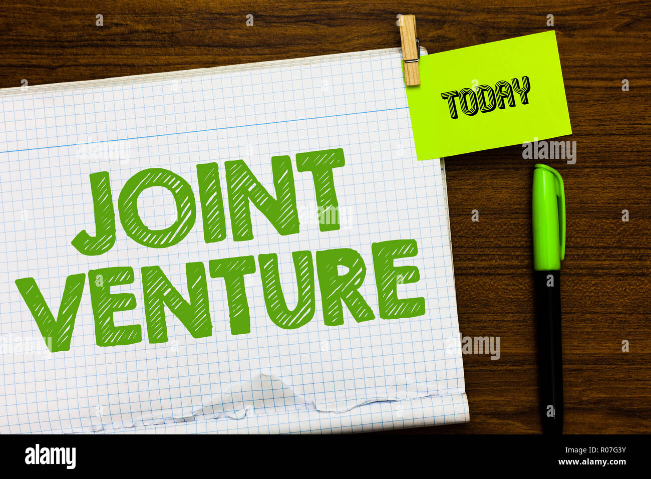 Writing note showing Joint Venture. Business photo showcasing ...