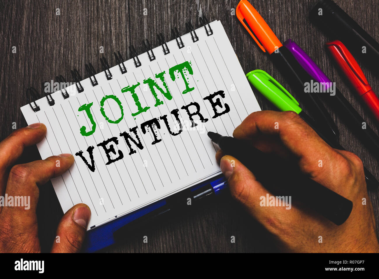 Handwriting text writing Joint Venture. Concept meaning Collaboration ...