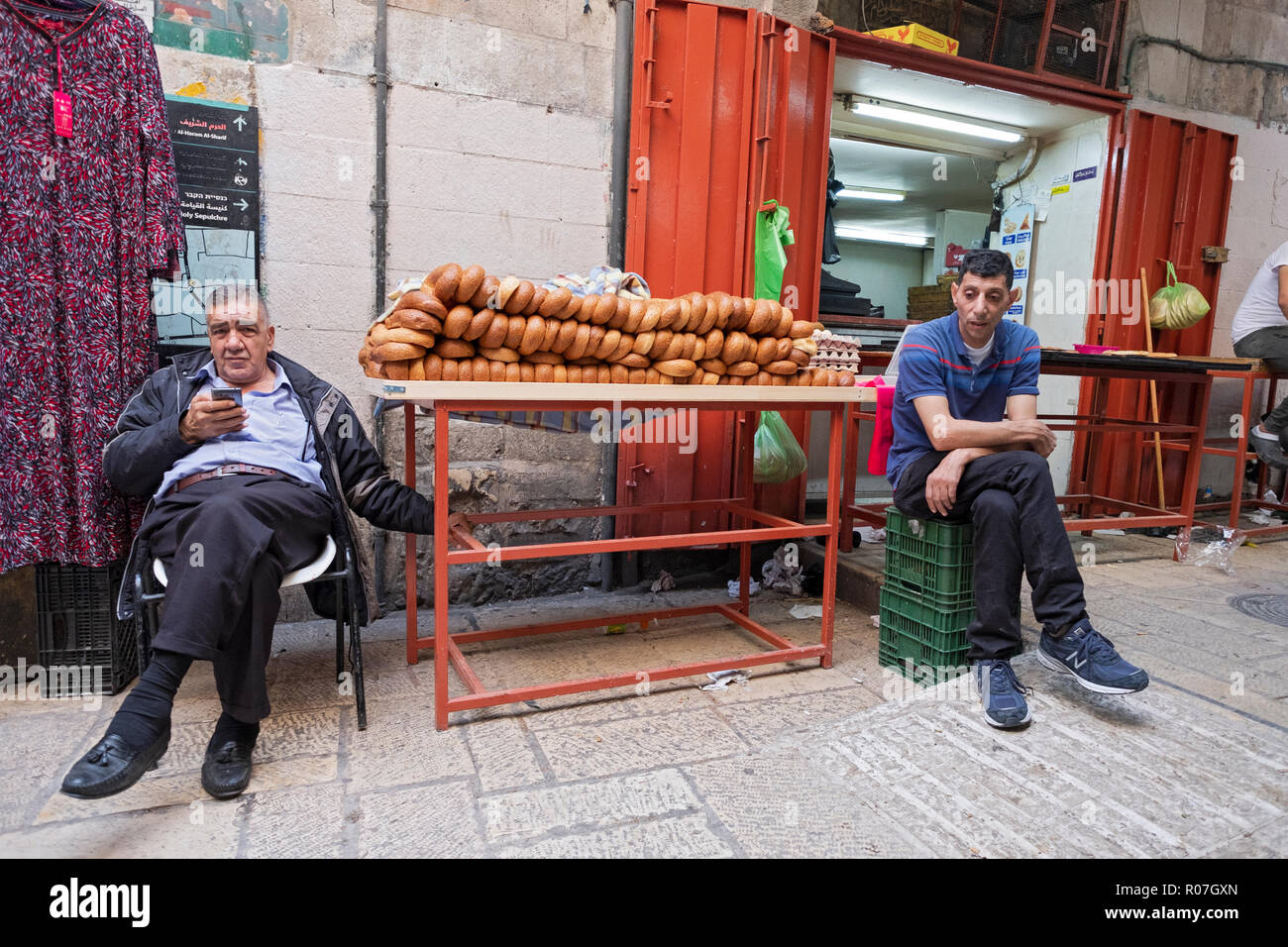Arabic merchants in front of their bakery selling breads in the Muslim ...