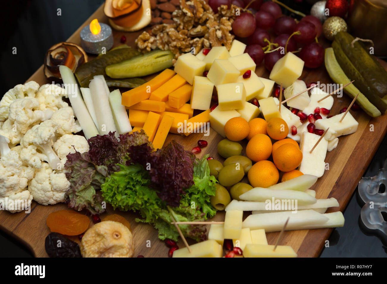Delicious Cheese Board With Nice Decorations Stock Photo - Alamy