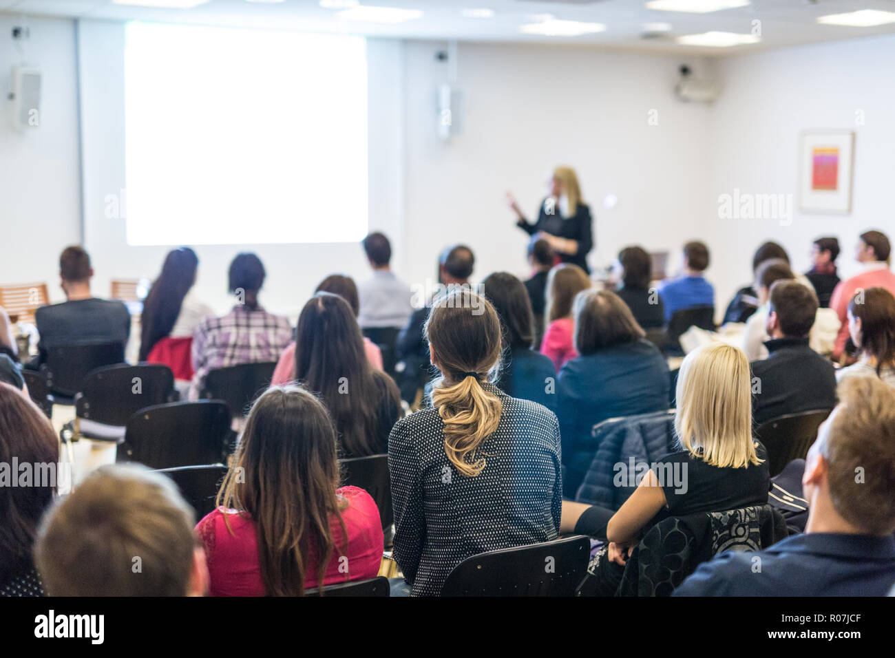 Woman giving presentation on business conference workshop Stock Photo ...