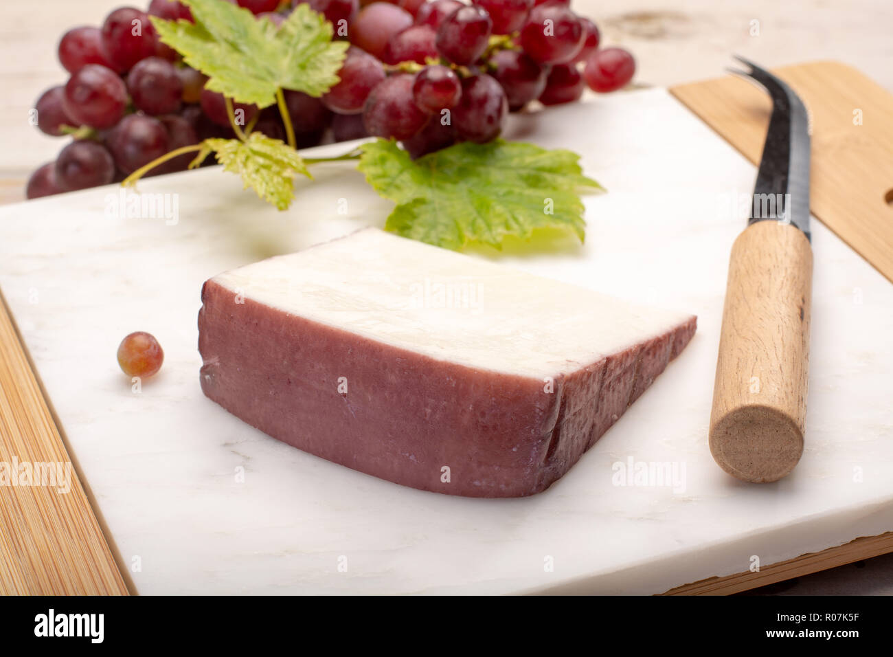 Traditional Spanish cheese, one piece of Murcian wine cheese from goat ...
