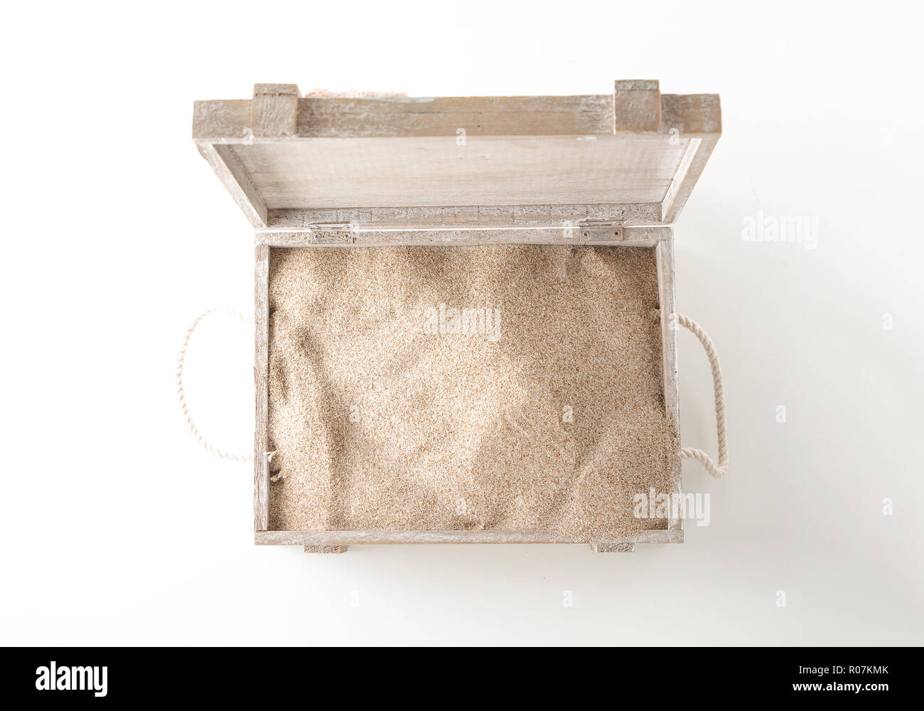 Opened wooden chest full with sand, on white background Stock Photo - Alamy