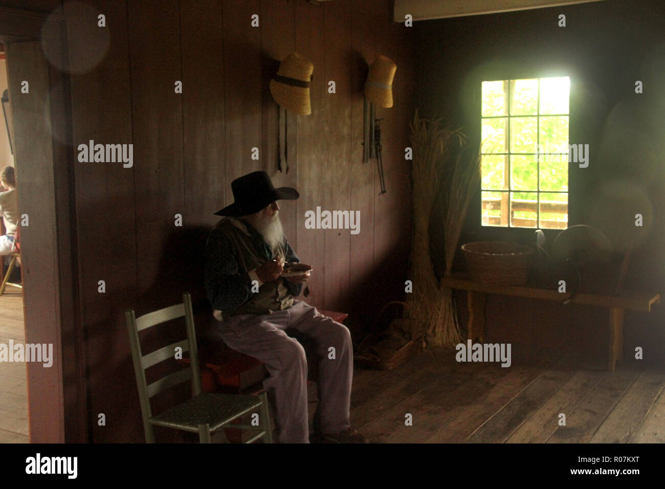 Reenactment at the Frontier Culture Museum in Staunton, VA. Old man in ...