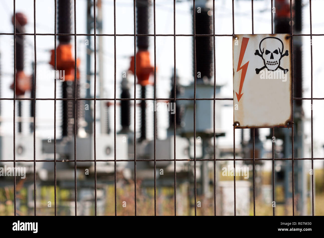 Old and rusty Danger Keep Out High Voltage Sign on power plant entrance ...