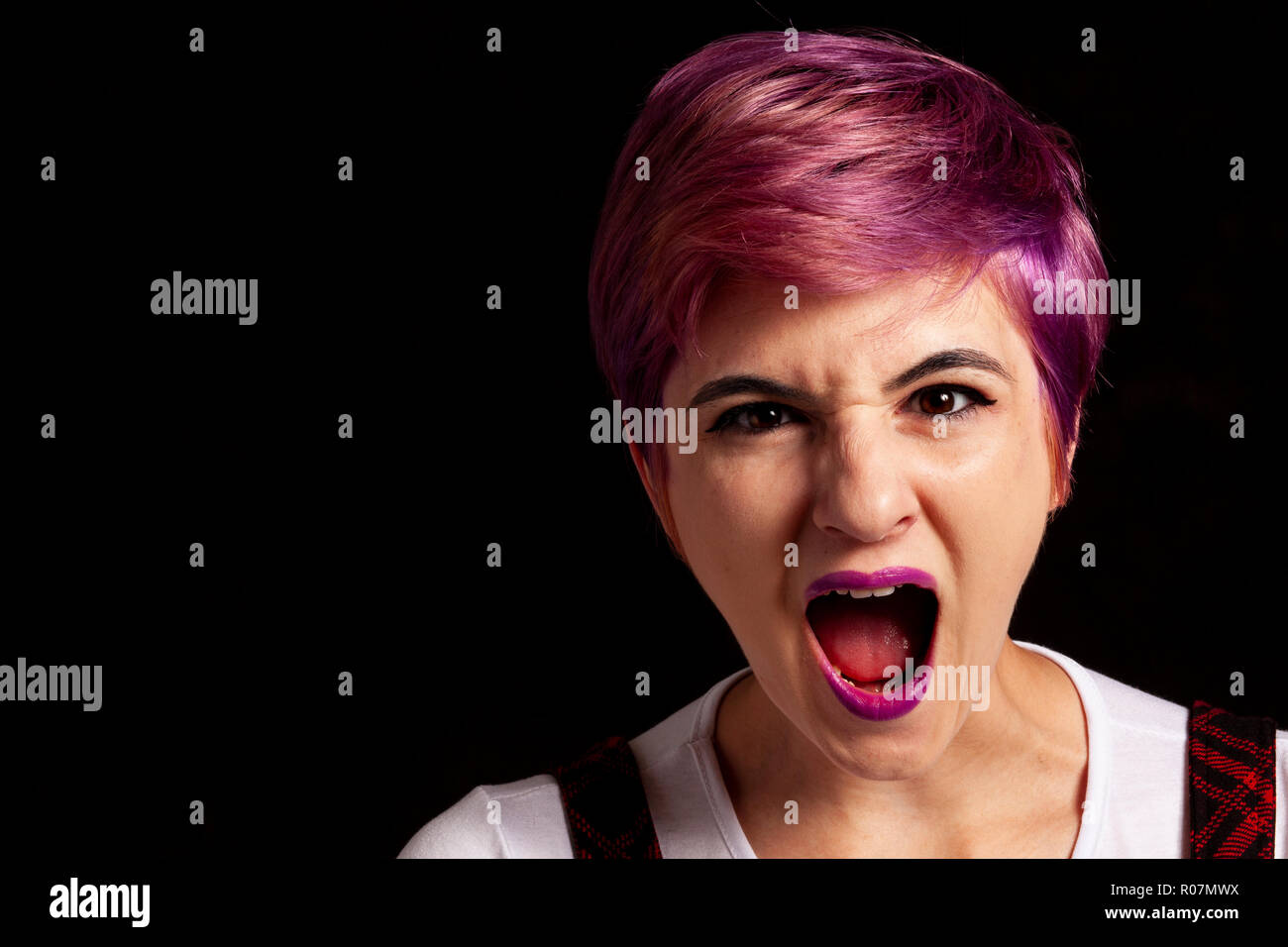 young girl shouting - black background Stock Photo - Alamy