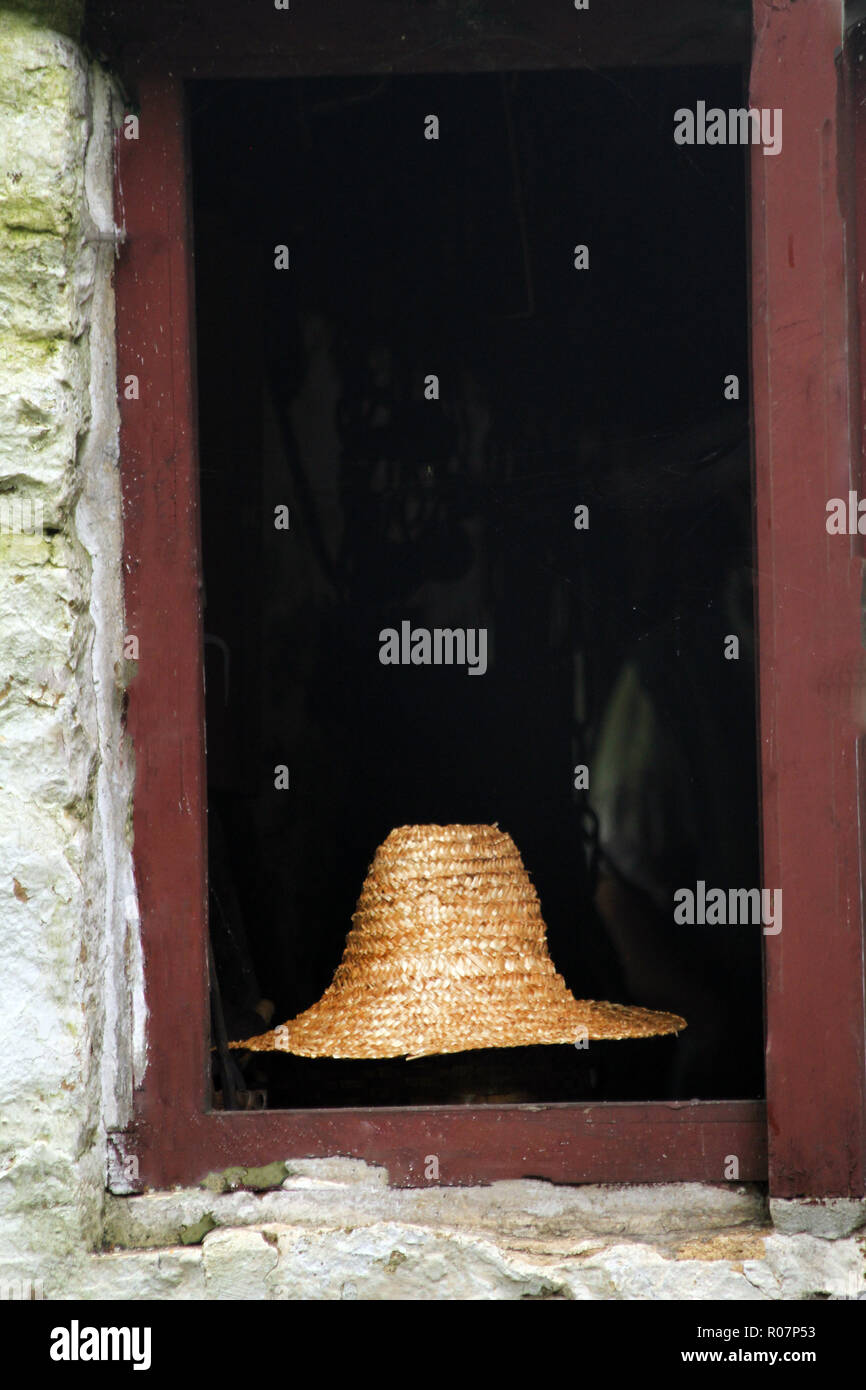 Hat in window frame Stock Photo - Alamy
