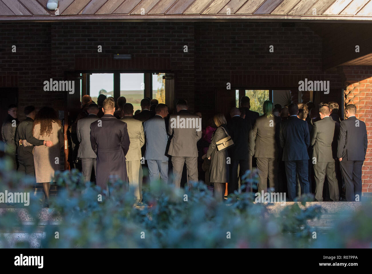 Mourners stand outside during the funeral of M40 caravan crash victim ...